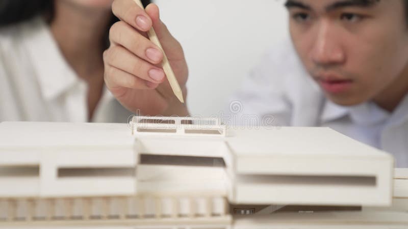 Architect Team Using Pencil To Test House Model Durability. Immaculate ...