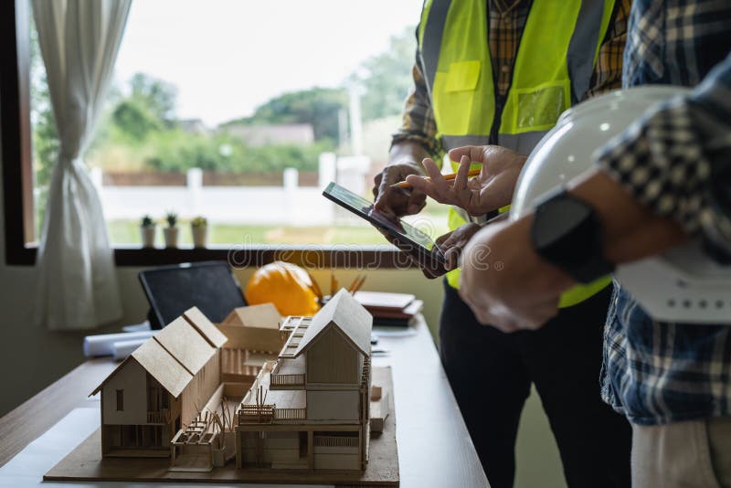 Architect Team Working with Blueprints for Architectural Plan, Engineer Sketching a Construction ...
