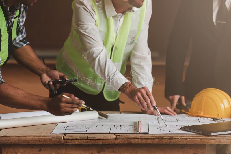 Architect Team Working with Blueprints for Architectural Plan, Engineer ...