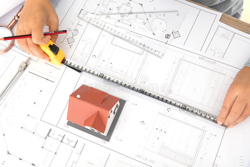 The Architect Uses a Ruler To Make Construction Drawings Stock Photo ...