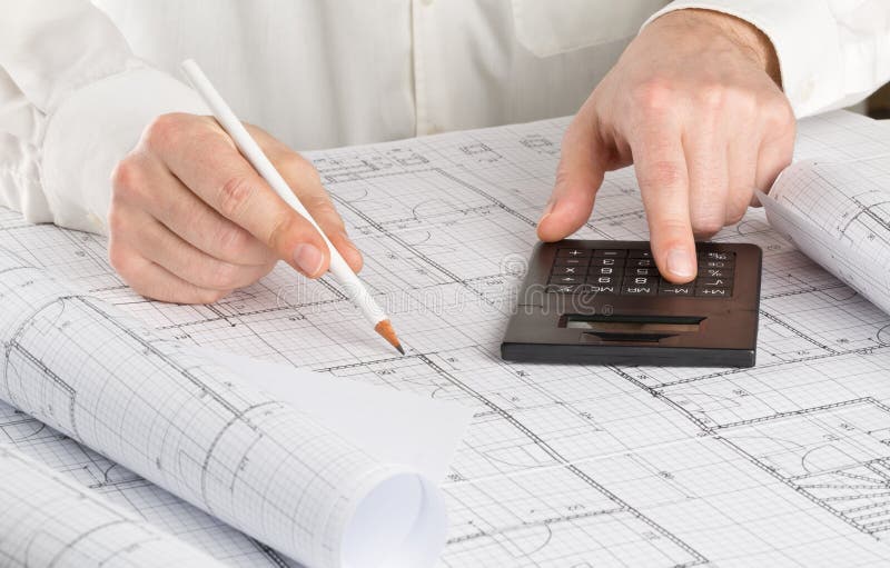 Architect Using Calculator on Architectural Blueprint House Building ...