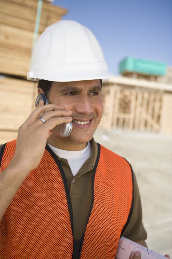 Architect Using Cell Phone at Site Stock Image - Image of contractor ...