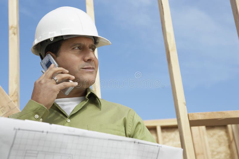 Architect Using Cellphone at Construction Site Stock Image - Image of ...