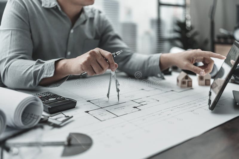 Architect Using Divider Compass Working on Blueprint. House Planning ...