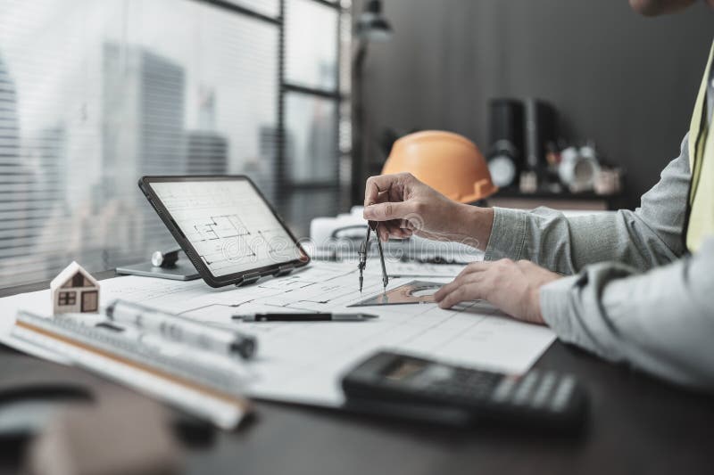 Architect Using Divider Compass Working on Blueprint. House Planning ...