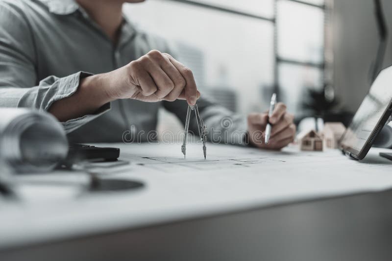 Architect Using Divider Compass Working on Blueprint. House Planning ...