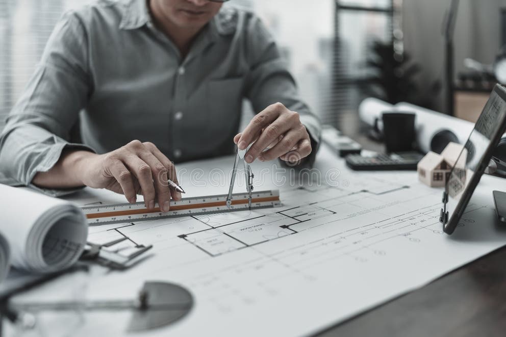 Architect Using Divider Compass Working on Blueprint. House Planning Design and Construction ...