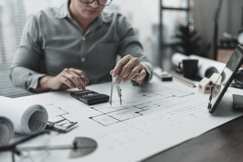 Architect Using Divider Compass Working on Blueprint. House Planning ...