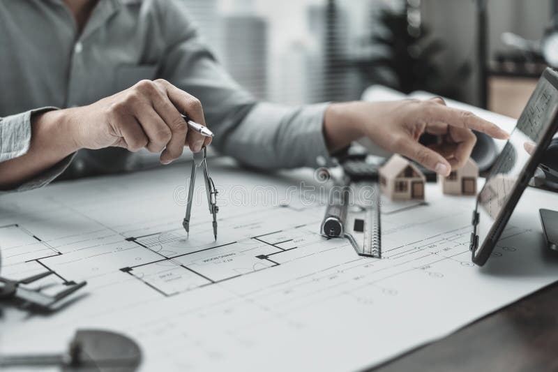 Architect Using Divider Compass Working on Blueprint. House Planning ...