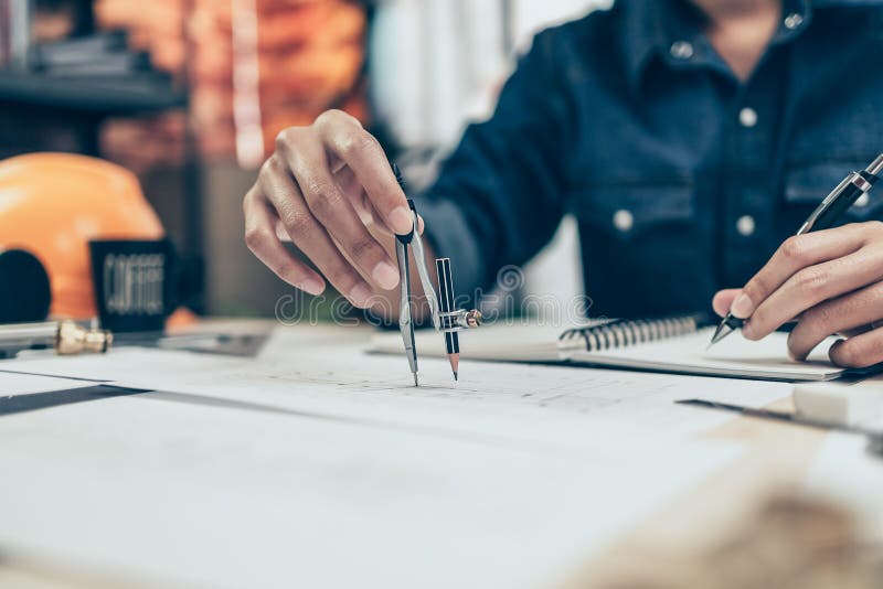 Architect Using Divider Compass Working on Blueprint. House Planning ...