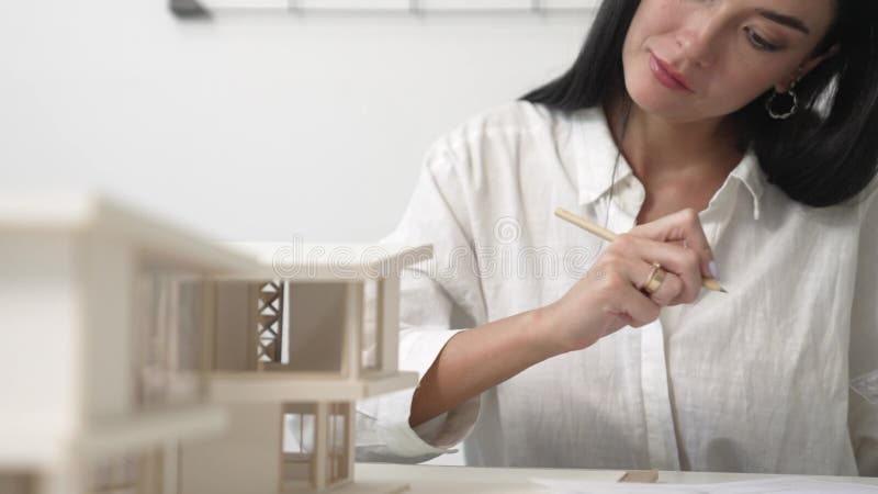 Architect Using Ruler To Measure House Model at Modern Office ...