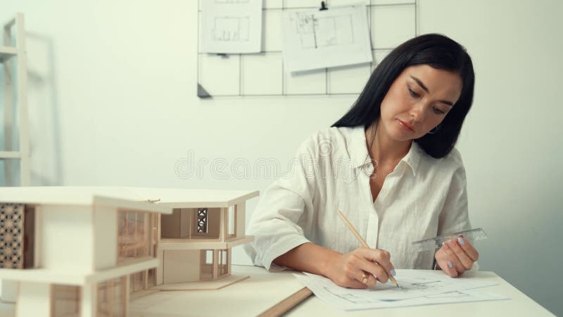 Architect Using Ruler To Measure House Model at Modern Office ...