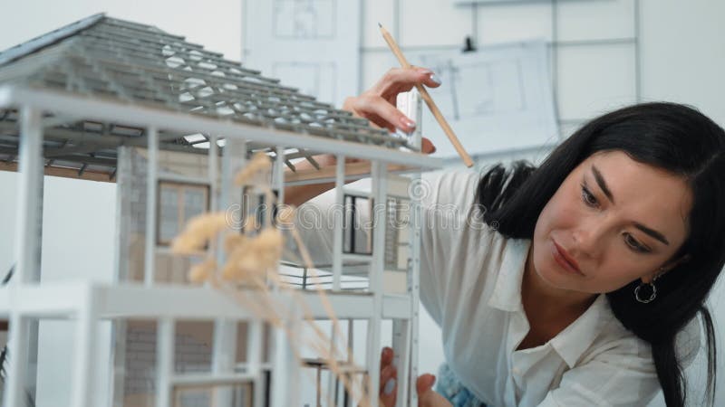 Architect Using Ruler To Measure House Model at Modern Office ...