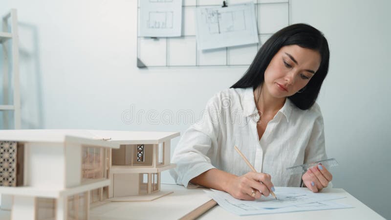 Architect Using Ruler To Measure House Model at Modern Office ...
