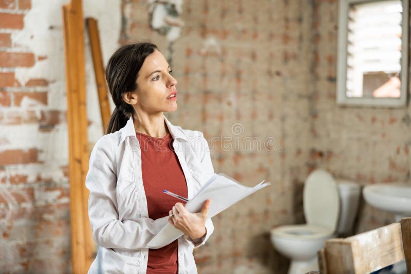 Architect Woman Checks According To the Plan Completed Repair Work ...