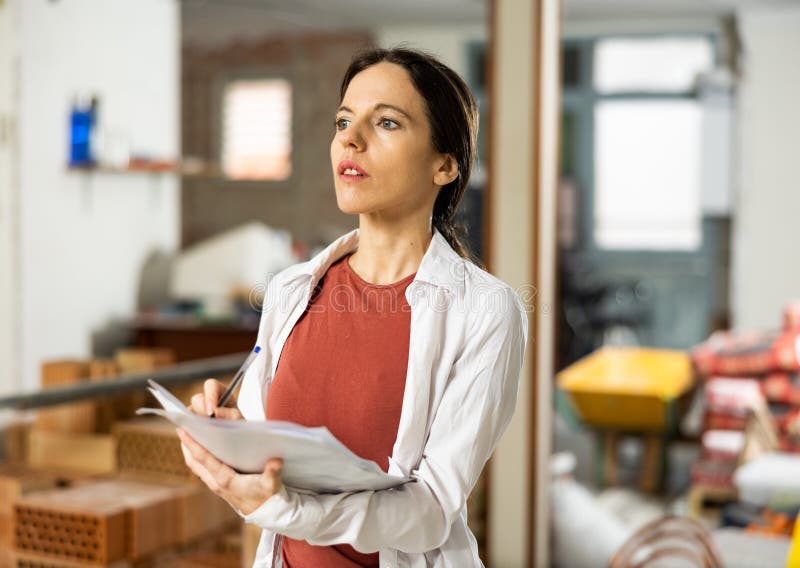 Architect Woman Checks According To the Plan Completed Repair Work ...