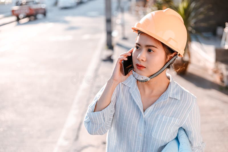 Architect Woman Use Mobile Phone Call with Enginner or Project Manager ...