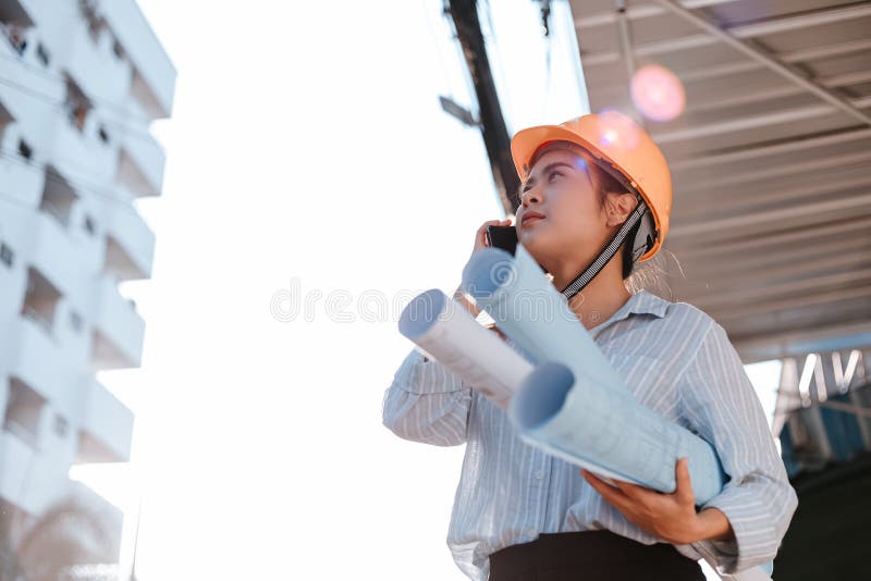 Architect Woman Use Mobile Phone Call with Enginner or Project Manager ...