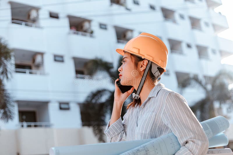 Architect Woman Use Mobile Phone Call with Enginner or Project Manager ...