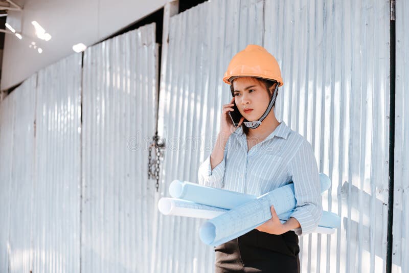 Architect Woman Use Mobile Phone Call with Enginner or Project Manager ...