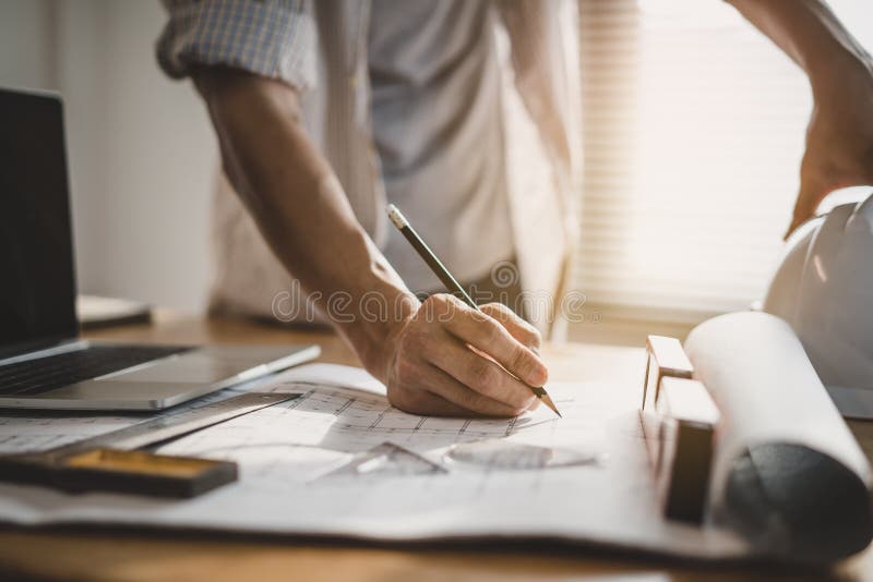 Architect Work Concept. Close Up Hand of Architect Writing on the ...