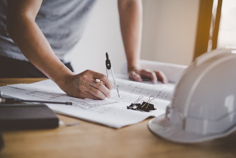 Architect Work Concept. Close Up Hand of Architect Writing on the ...