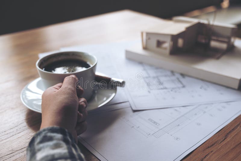 An Architect Working on an Architecture Model with Shop Drawing Paper ...