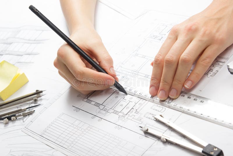 Architect Working on Blueprint. Architects Workplace - Architectural ...
