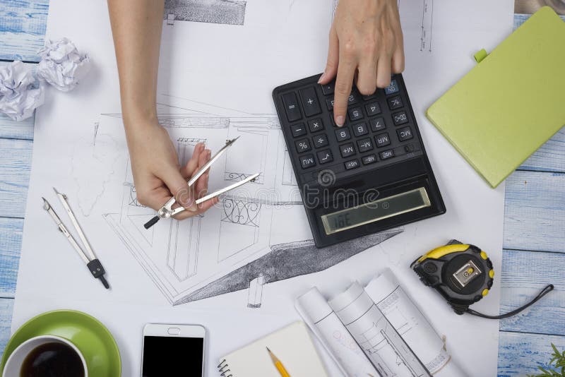 Architect Working on Blueprint. Architects Workplace - Architectural ...