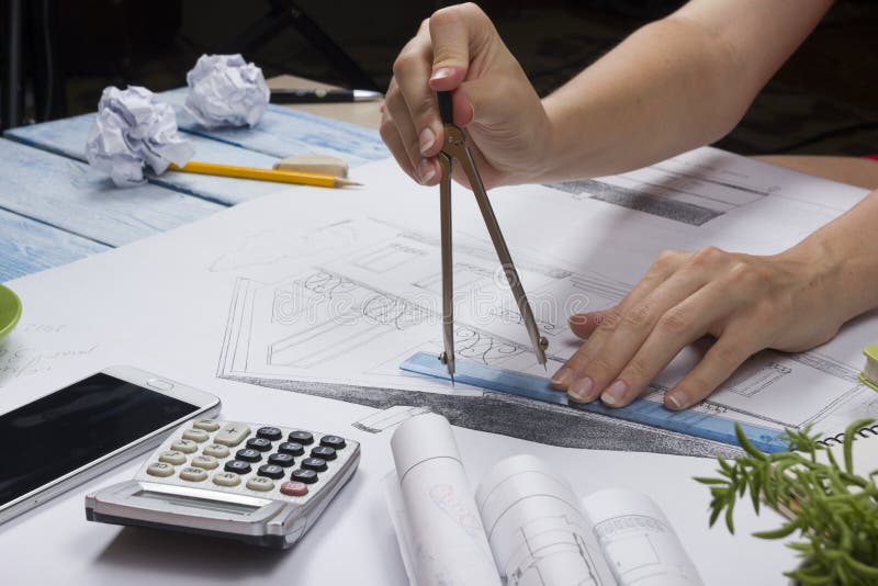 Architect Working on Blueprint. Architects Workplace - Architectural ...