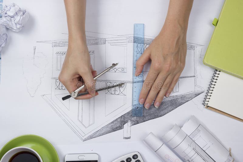 Architect Working on Blueprint. Architects Workplace - Architectural ...