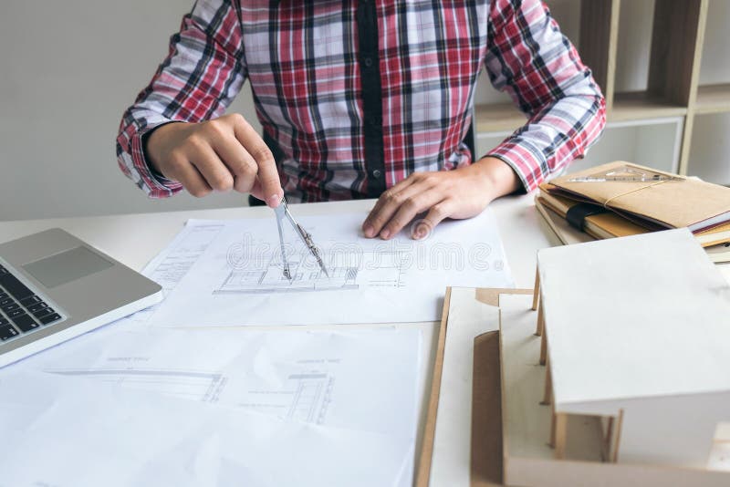 Architect Working on Blueprint, Engineer Working with Engineering Tools ...