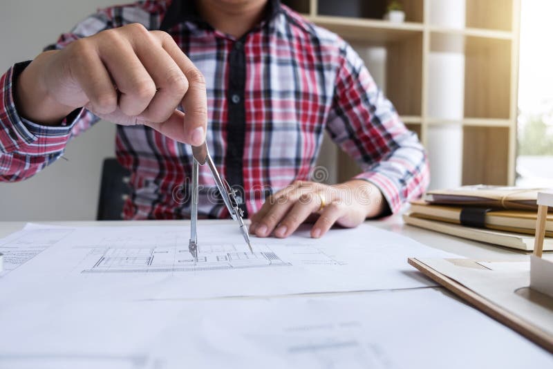 Architect Working on Blueprint, Engineer Working with Engineering Tools ...