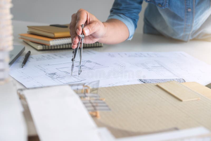 Architect Working on Blueprint, Engineer Working with Engineering Tools ...