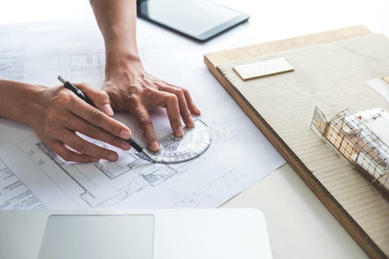 Architect Working on Blueprint, Engineer Working with Engineering Tools ...