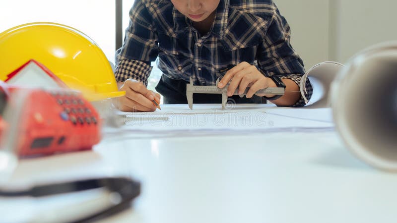 Architect Working with Blueprints, Engineer Inspection in Workplace for ...