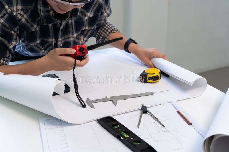 Architect Working with Blueprints, Engineer Inspection in Workplace for ...