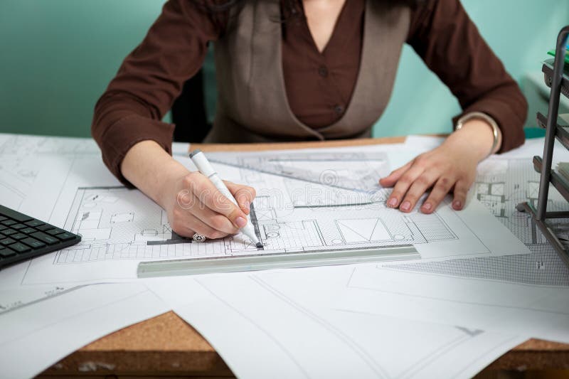 Architect Working on Blueprints on Her Desk Stock Image - Image of ...