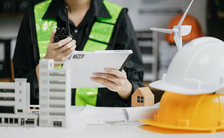 Architect Working with Blueprints for Sketching a Construction Project ...
