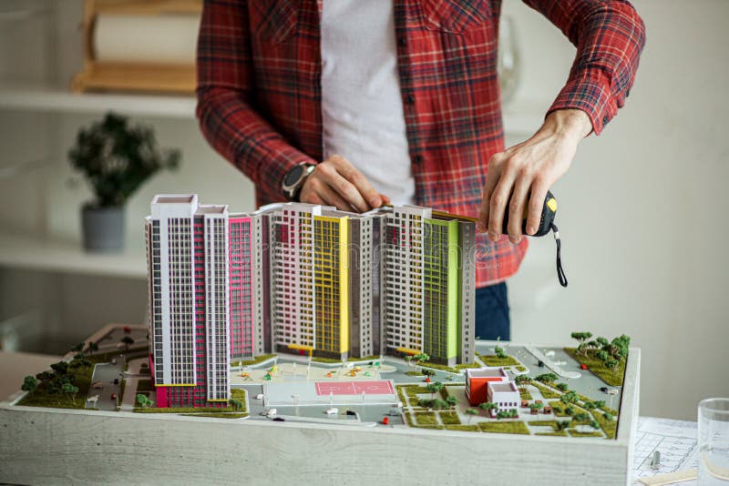 Architect Working With Building Model In Office Stock Photo - Image of ...
