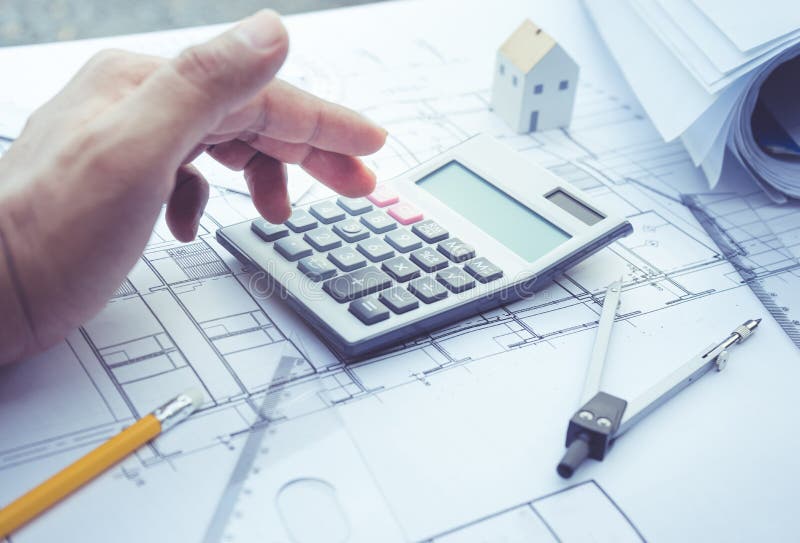 Architect Working with Calculator on Plan Design Paper Stock Photo ...