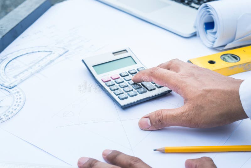 Architect Working with Calculator on Plan Design Paper Stock Photo ...