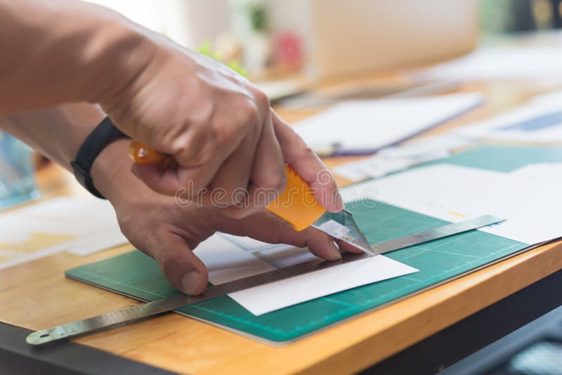 Close Up of Hands Cutting Paper Stock Photo - Image of background ...