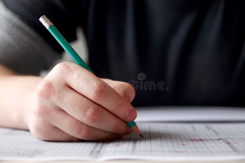 Architect Working on a Drawing Project, Hand with Pencil on Graph Paper ...