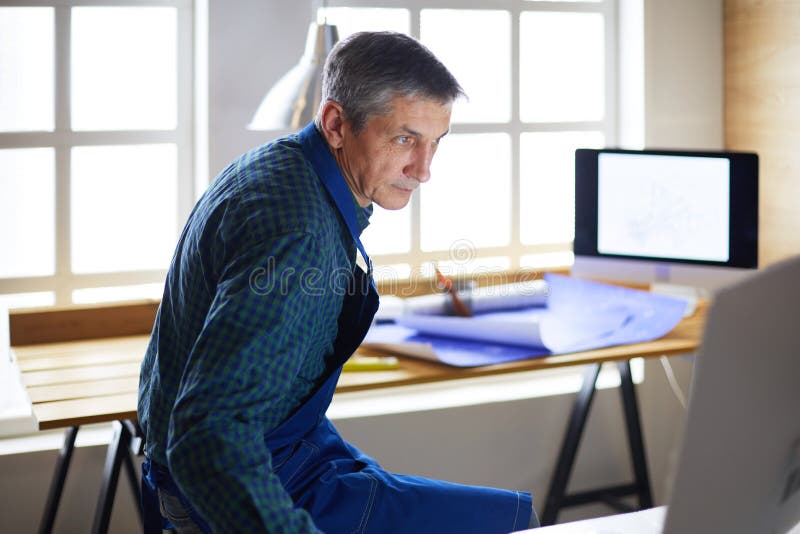 Architect Working on Drawing Table in Office Stock Image - Image of ...