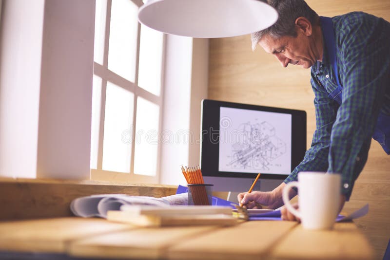 Architect Working on Drawing Table in Office Stock Photo - Image of ...