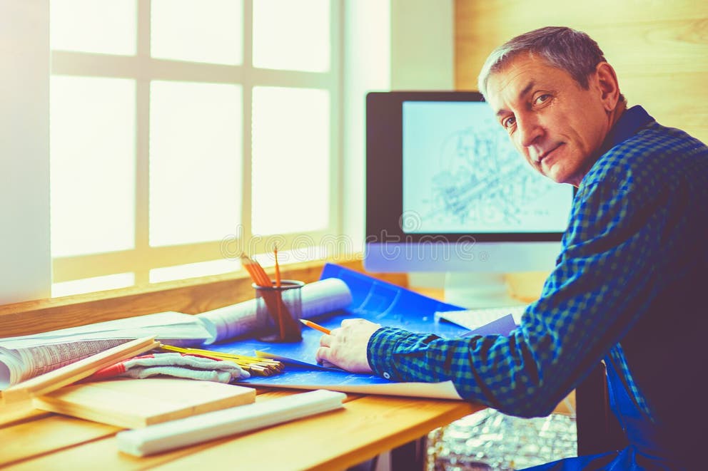 Architect Working on Drawing Table in Office Stock Photo - Image of ...