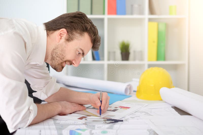 Architect Working on His Projects Paper in the Office Stock Photo ... Architect Working on His Projects Paper in the Office Stock Photo ...