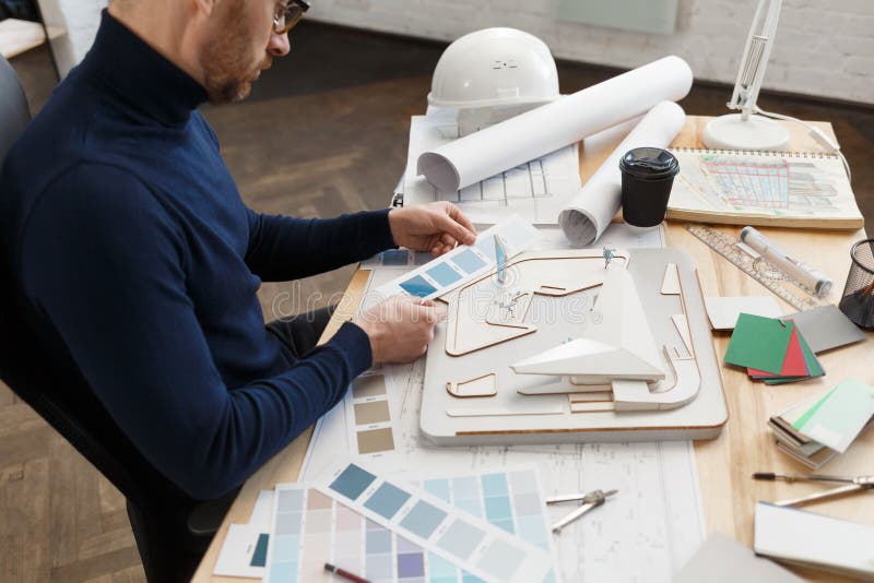 Architect Working in Office with Color Palette. Engineer Select Colors ...