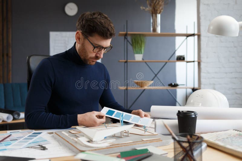 Architect Working in Office with Color Palette. Engineer Select Colors ...